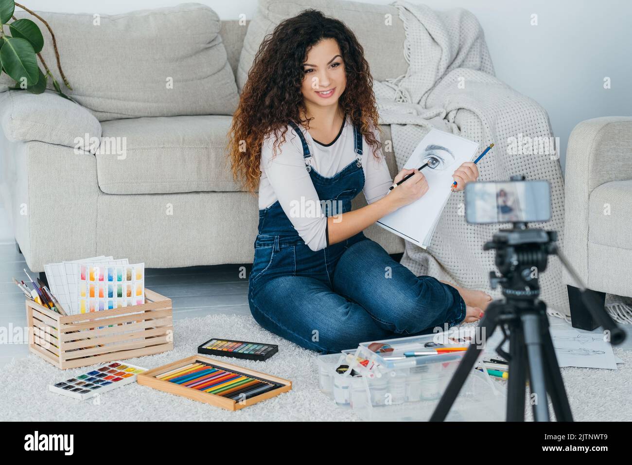 sketching art online class lady drawing video home Stock Photo - Alamy