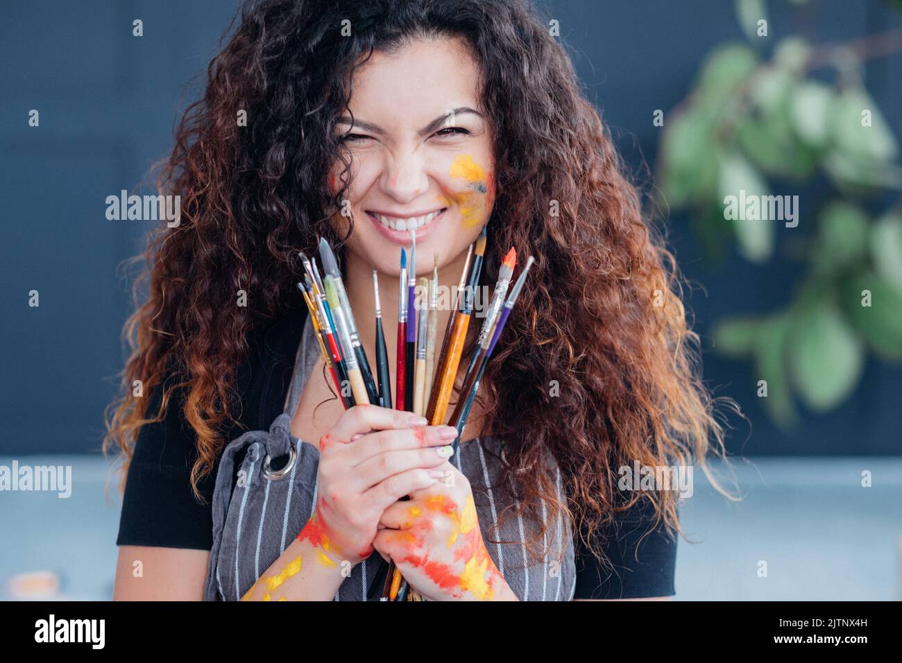modern fine art school lady bunch paintbrushes Stock Photo - Alamy