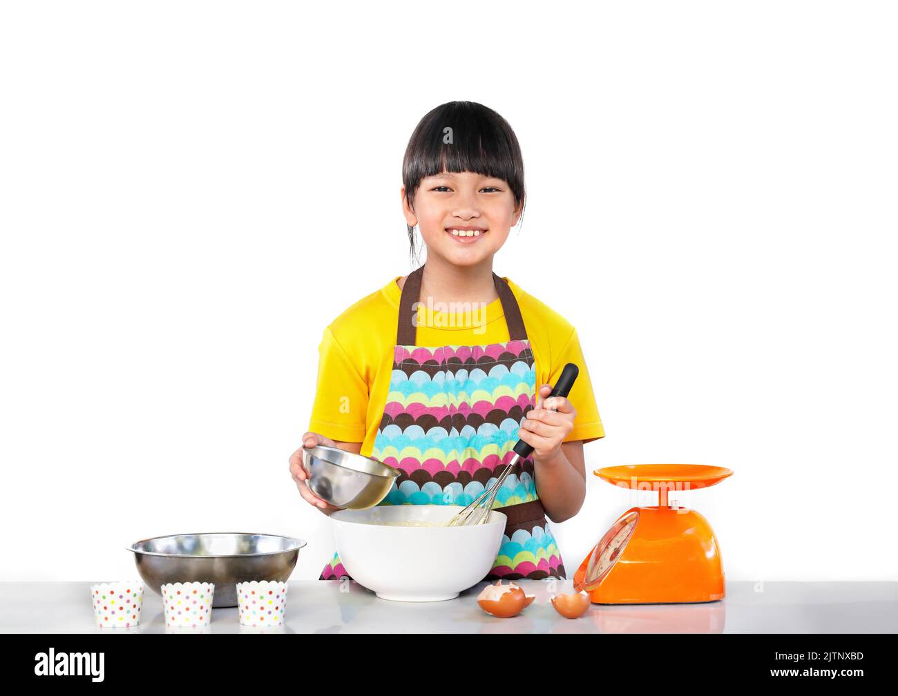 Asian girl making pastries in the kitchen. Isolated white background ...