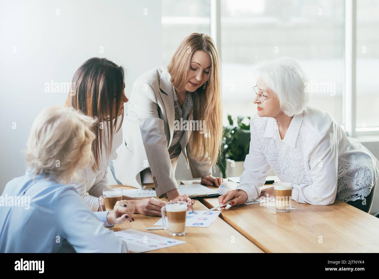 business women teamwork analysis brainstorming Stock Photo - Alamy