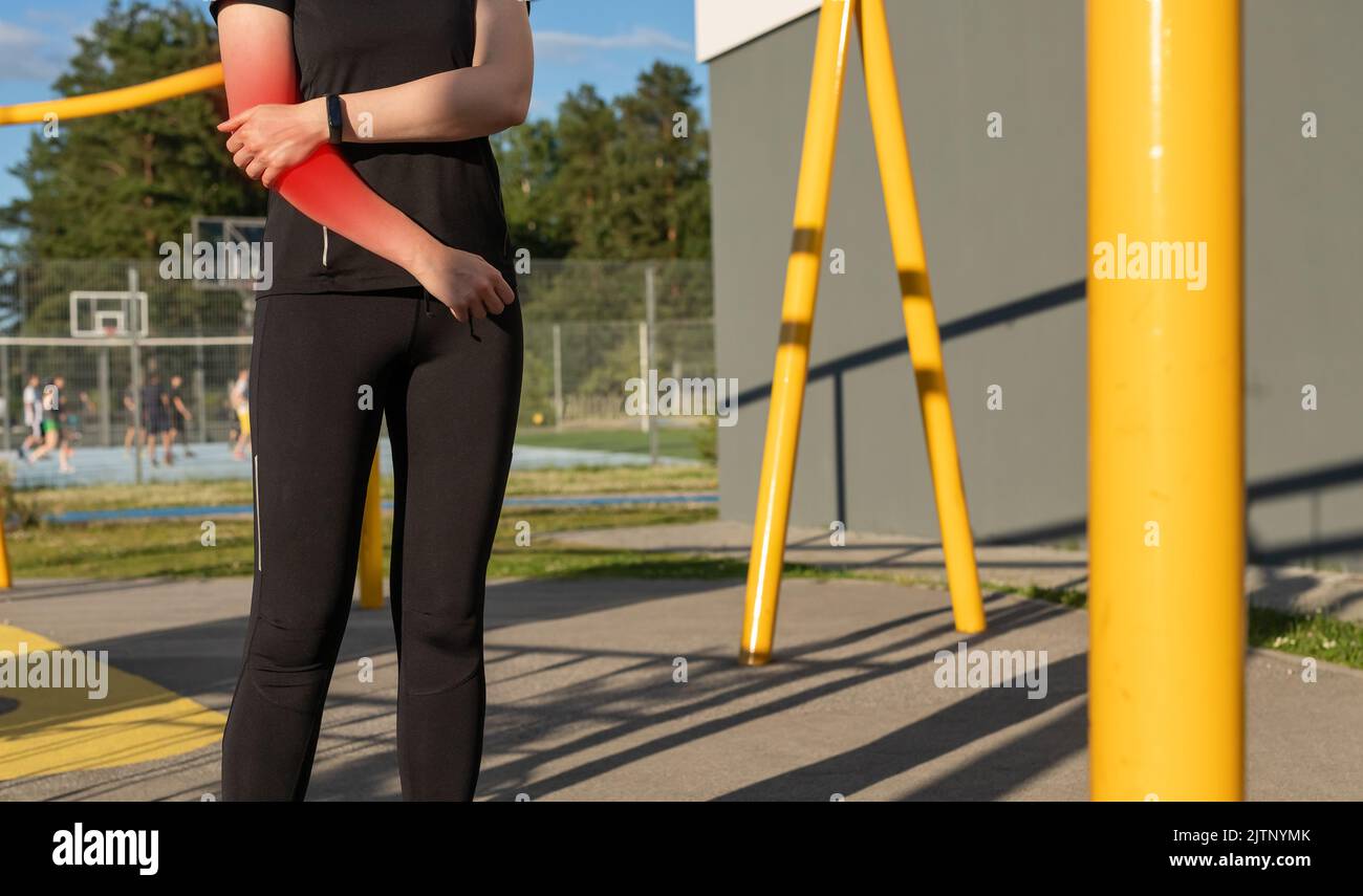Shoulder, forearm pain. Sports trauma. Woman holding painful elbow with ...
