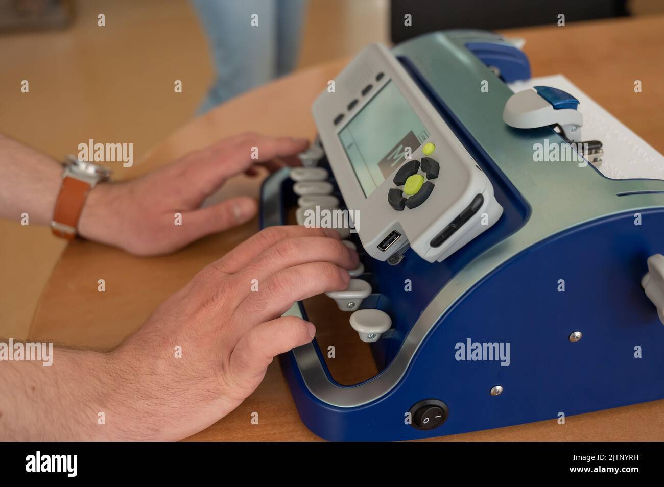 Blind man using braille typewriter Stock Photo - Alamy