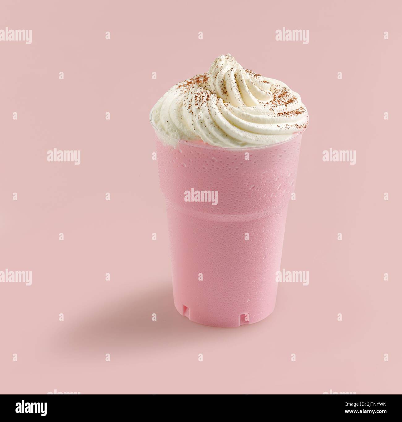 pink strawberry milkshake on pink background Stock Photo - Alamy