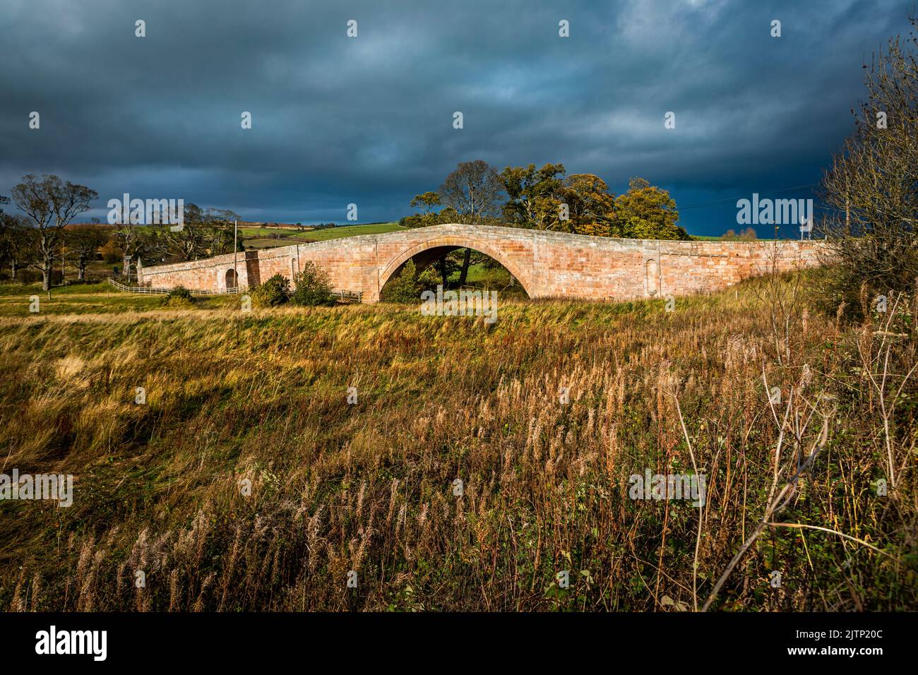 The red brick bridge over the River Till, Northumberland Stock Photo ...