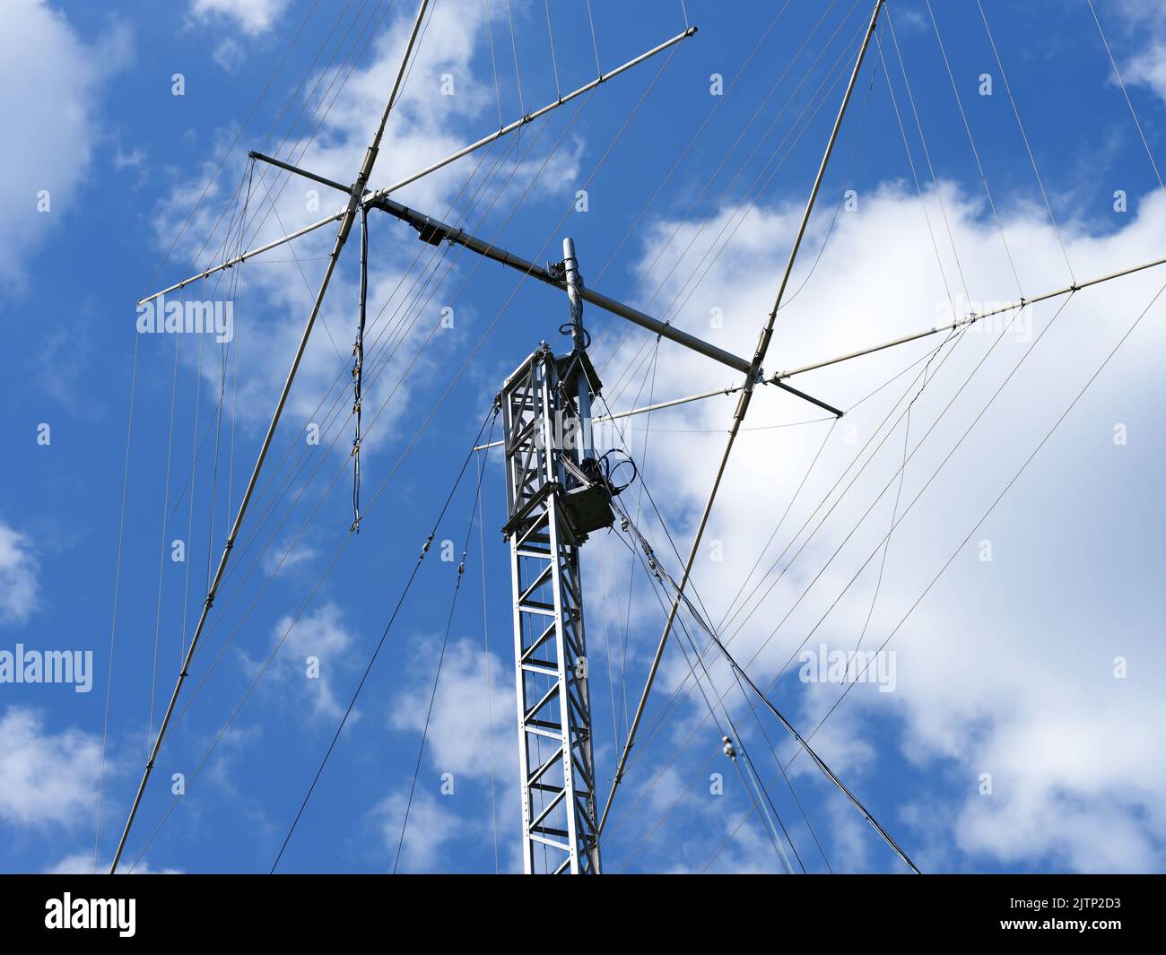 A close-up shot of a ham radio antenna against a cloudy sky Stock Photo - Alamy