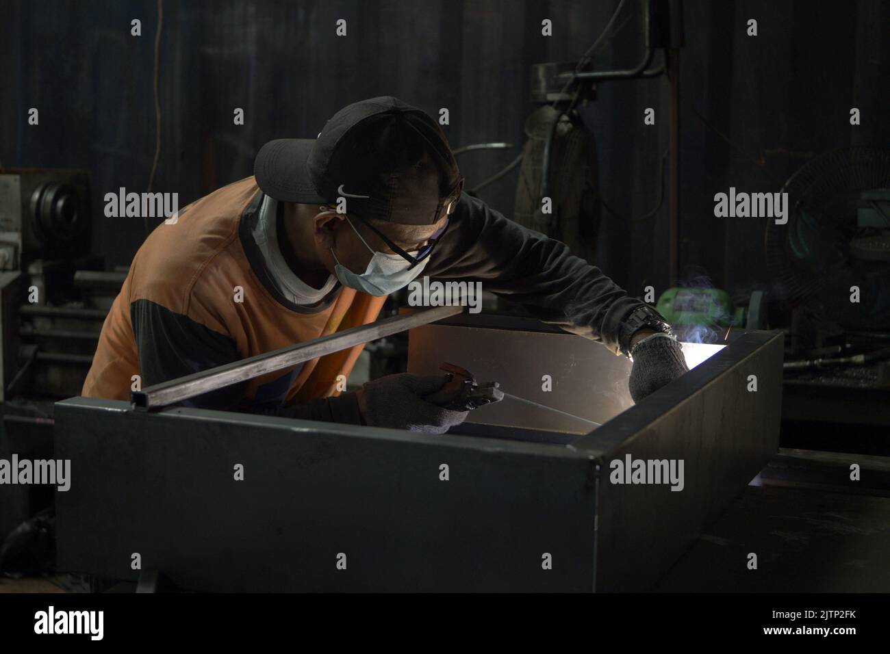 Jakarta, Indonesia - July 10, 2022: Asian people are doing iron welding ...