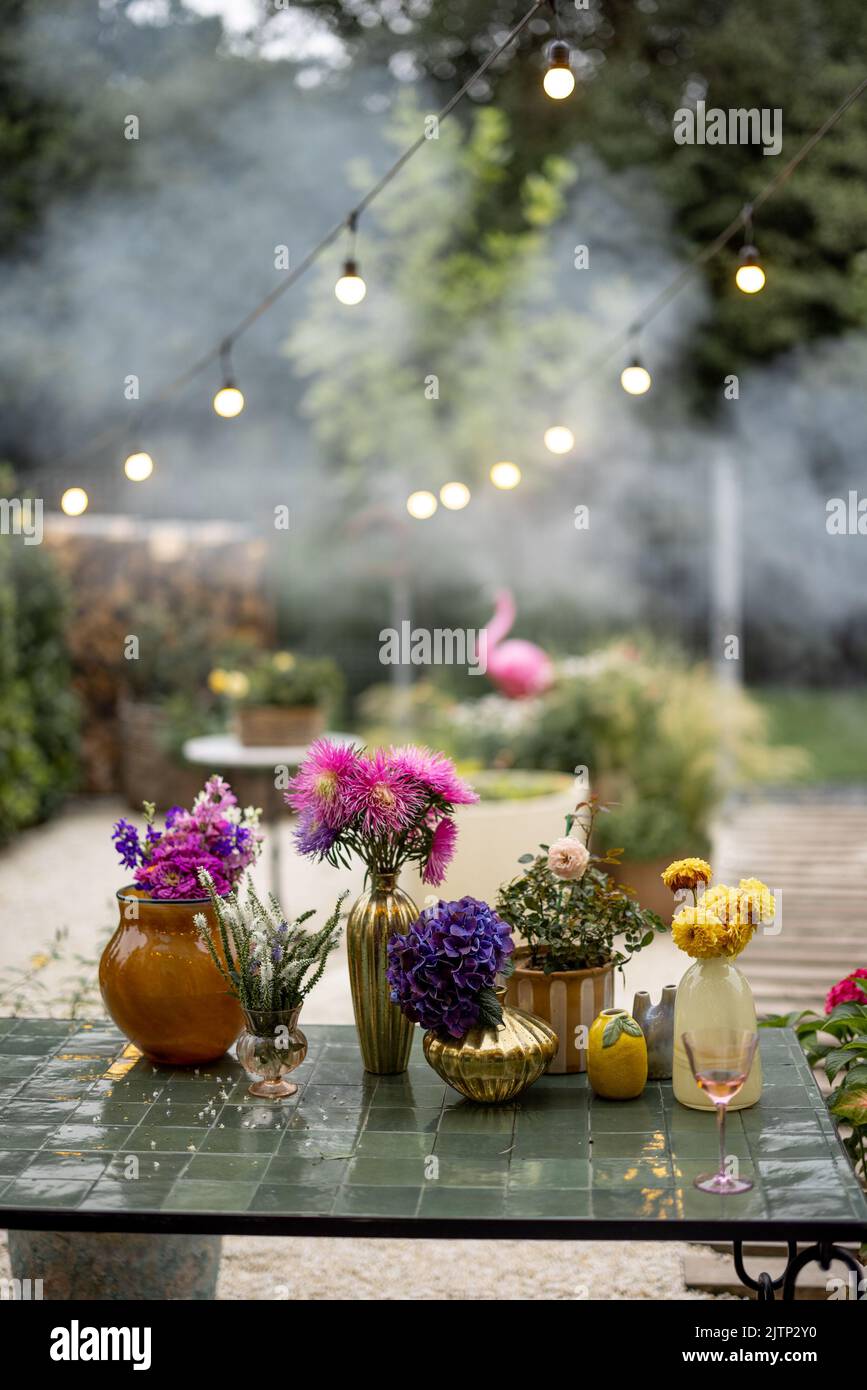 Flowers on table at backyard Stock Photo - Alamy