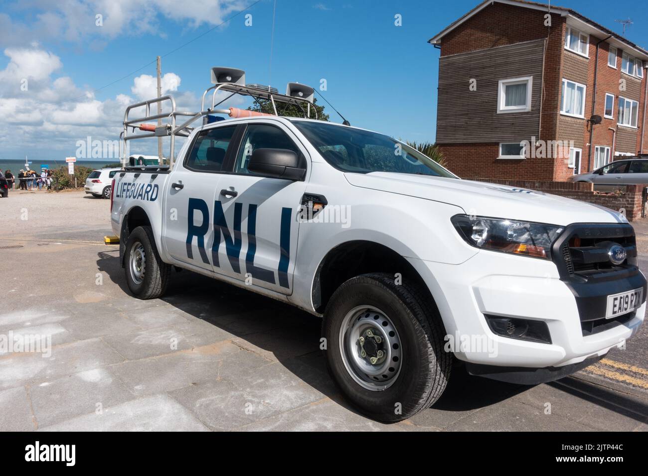 RNLI (Royal National Lifeboat Institution) vehicle parked on the cliff ...