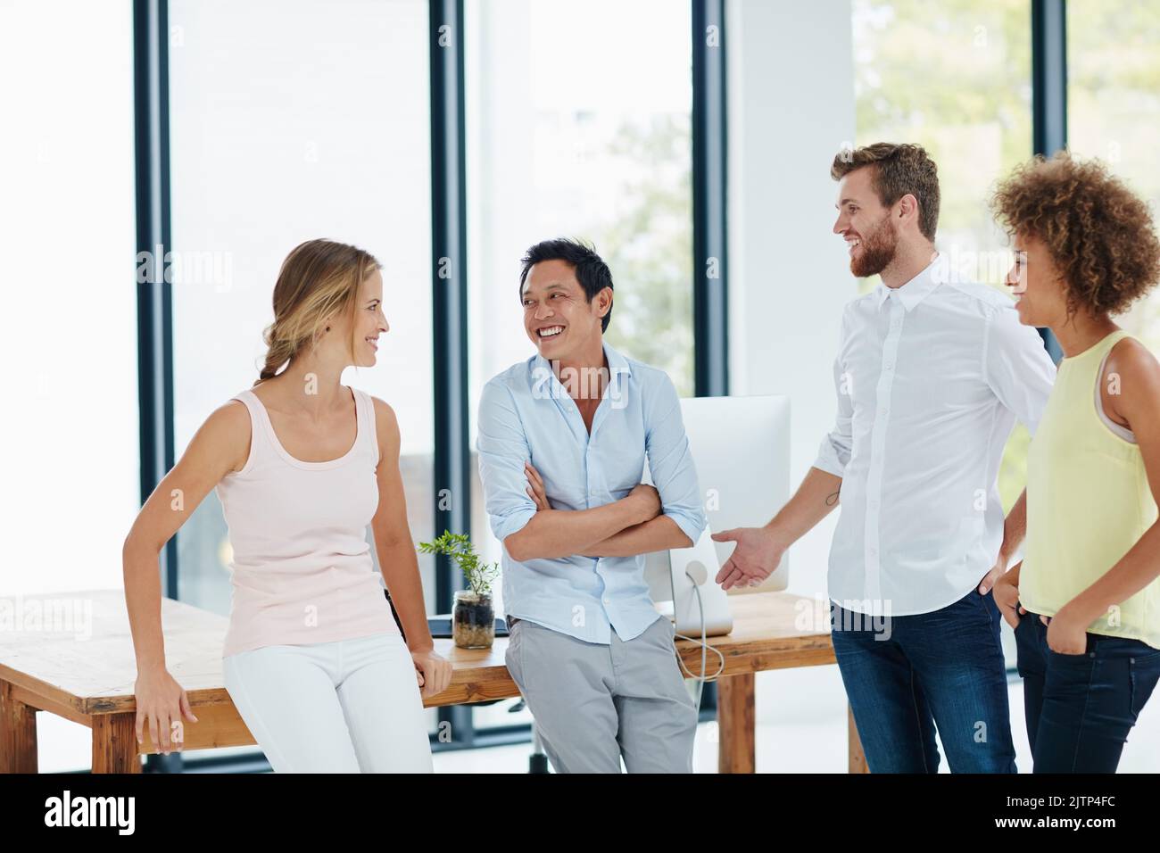 Sharing a lighthearted moment with colleagues. a group of colleagues ...