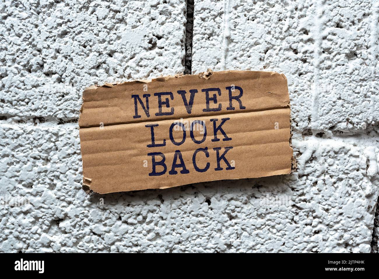 Sign displaying Never Look Back, Business showcase Do not have regrets ...
