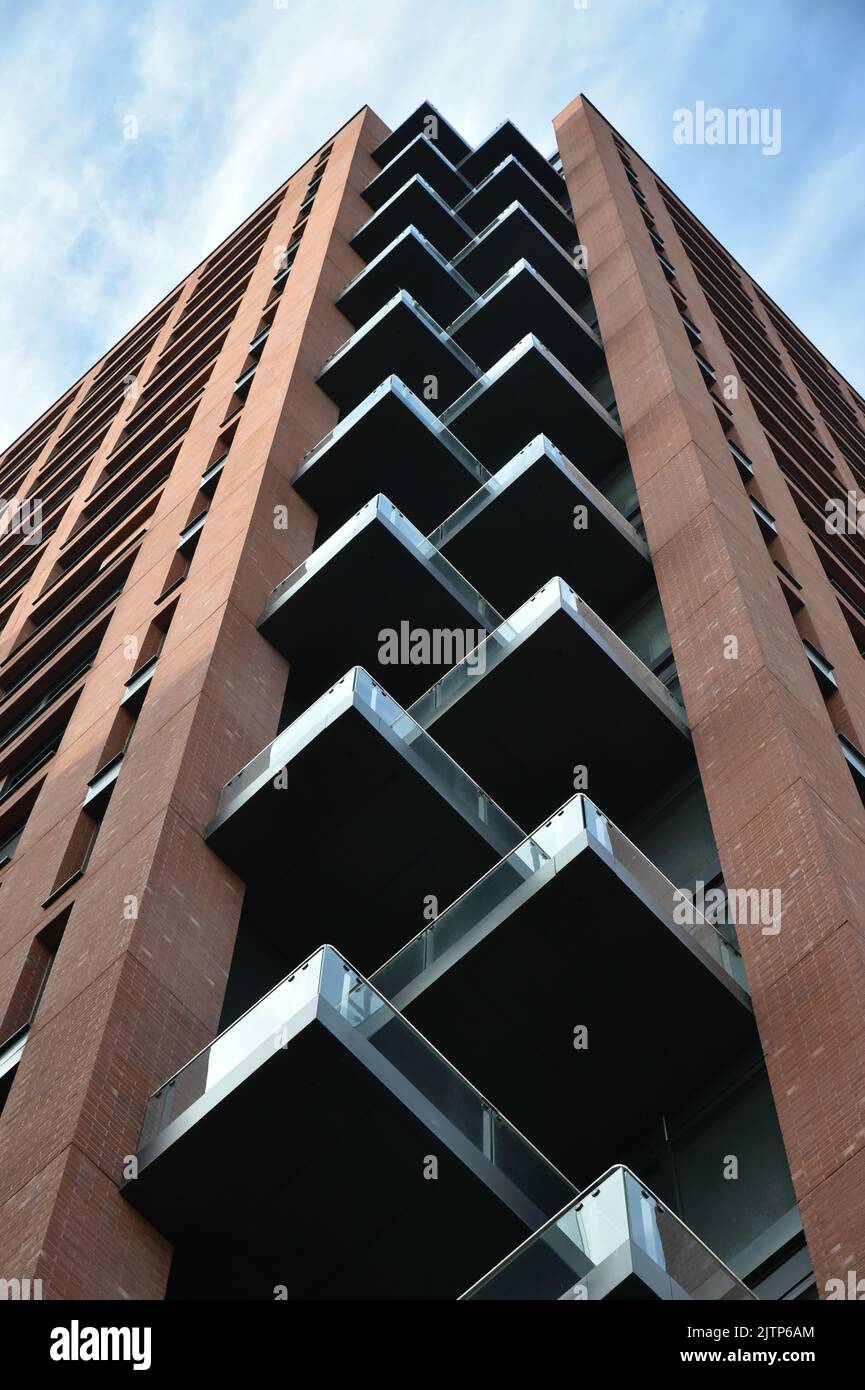 Looking up at Red Brick high rise apartment tower in east london Stock ...