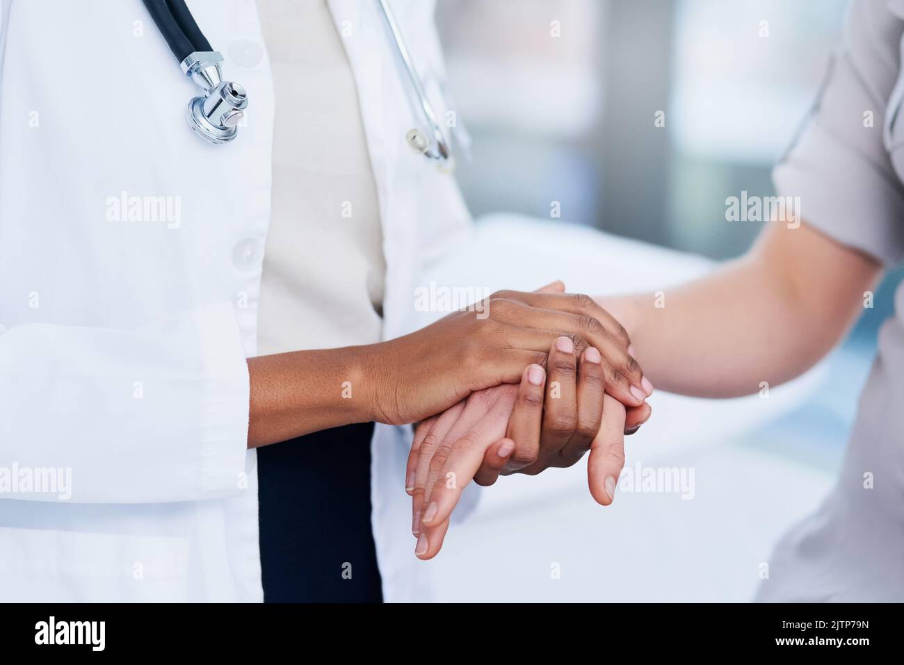 Ill be here every step of the way. a female doctor consoling a patient ...