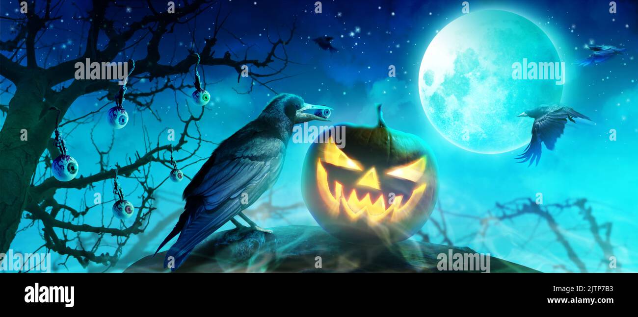Halloween background with raven in a spooky night Stock Photo - Alamy
