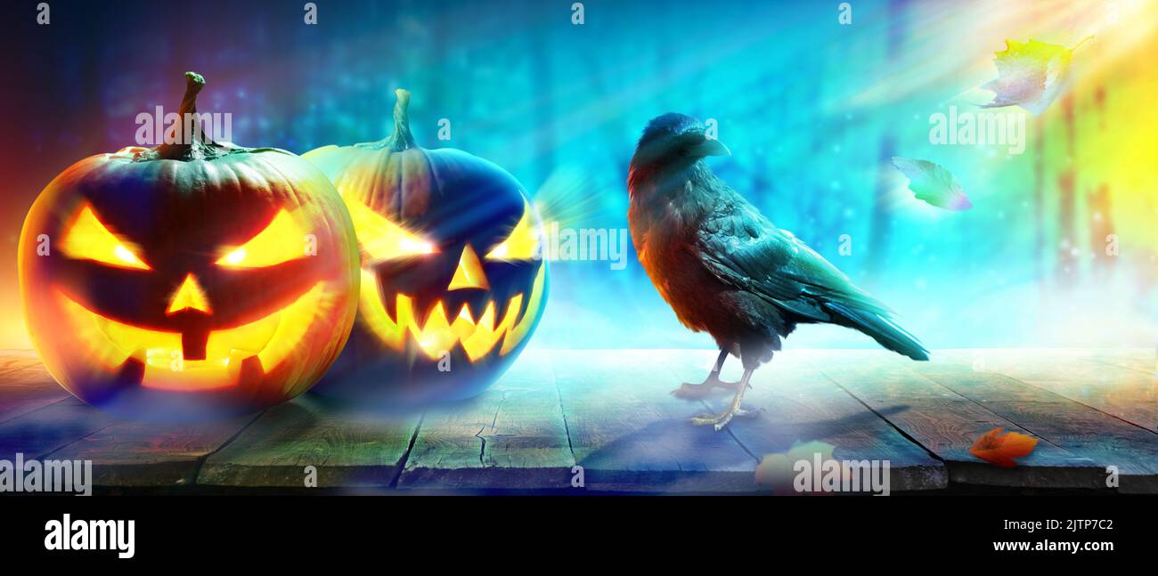 Halloween background with raven in a spooky night Stock Photo - Alamy