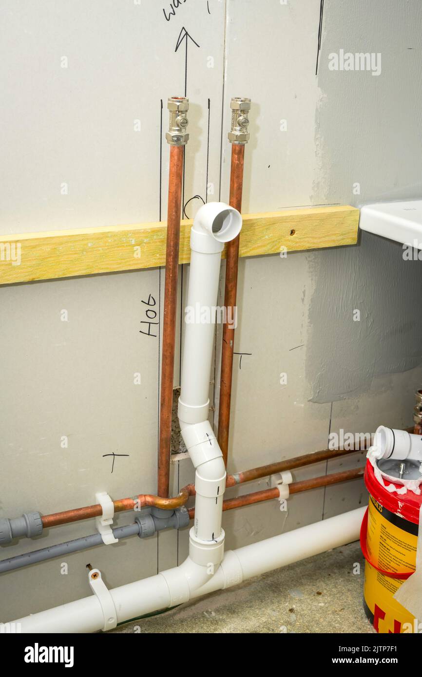 Bathroom tubes and pipe Stock Photo - Alamy