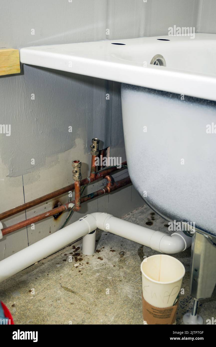 Bathroom tubes and pipe Stock Photo - Alamy