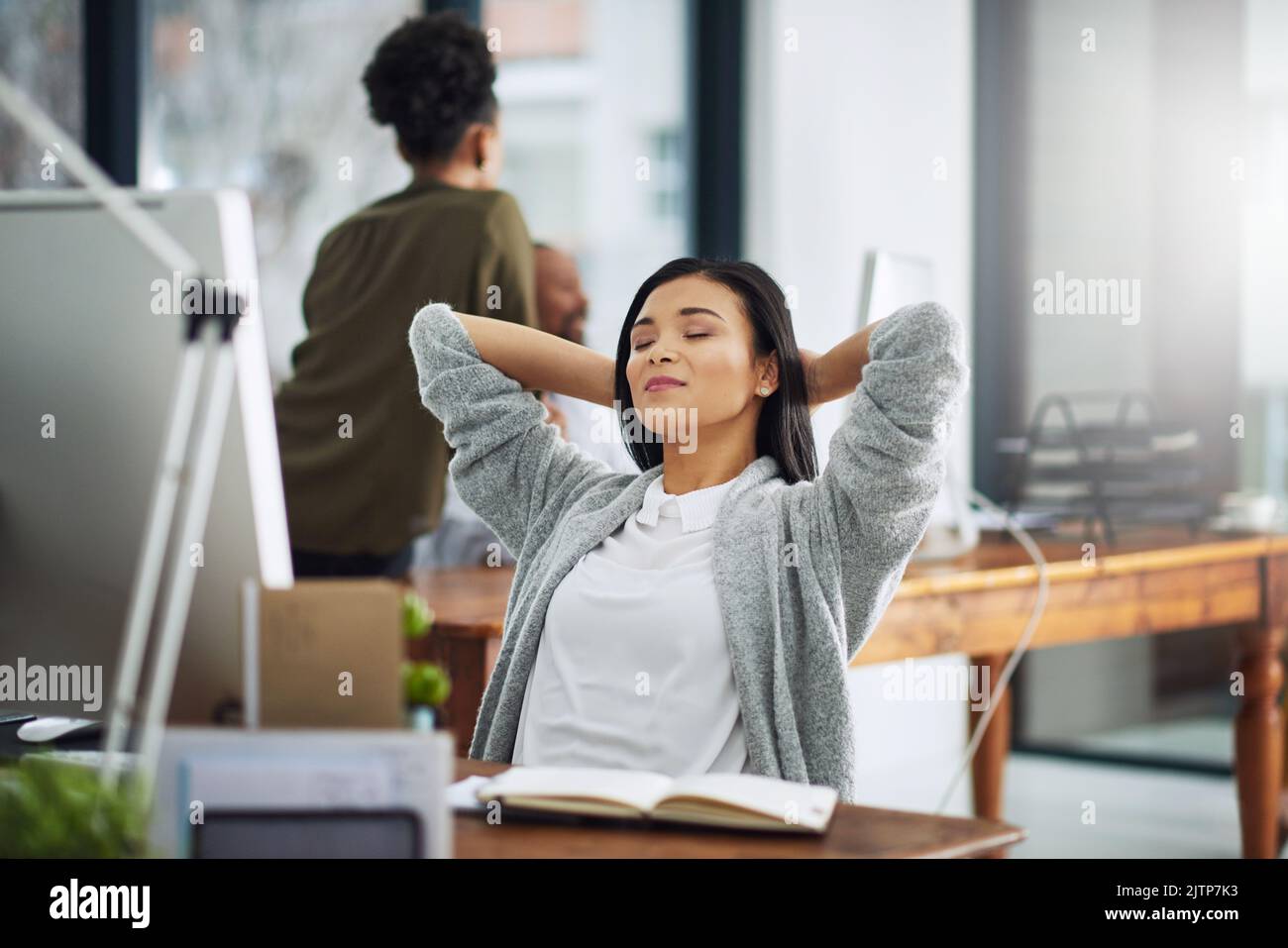 Taking a breather before jumping into work again. a young businesswoman ...