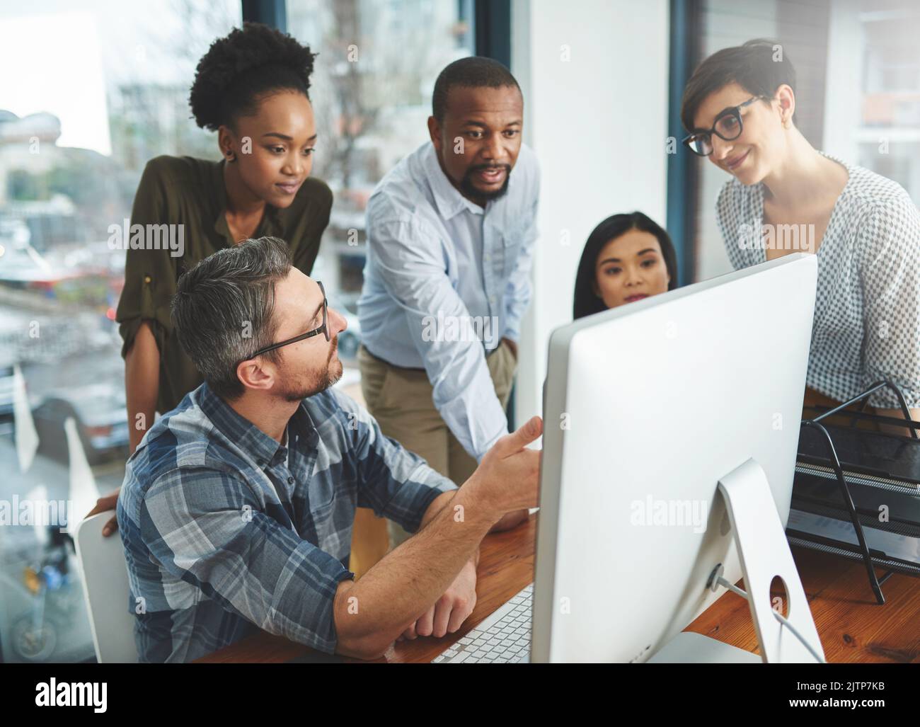 Working together to get the task done. businesspeople working together ...