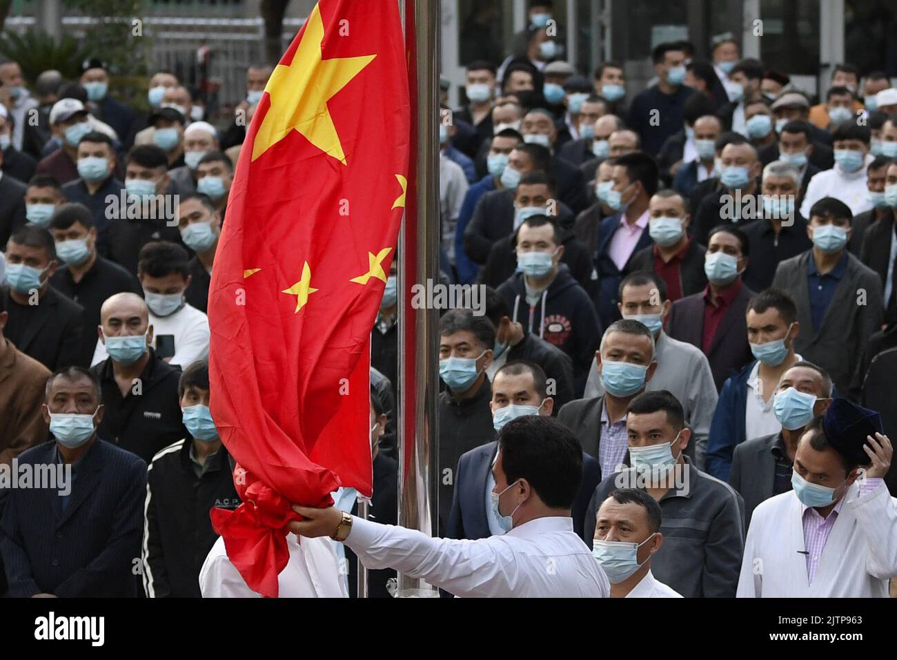 File photo taken in May 2021 shows people watching the Chinese national ...