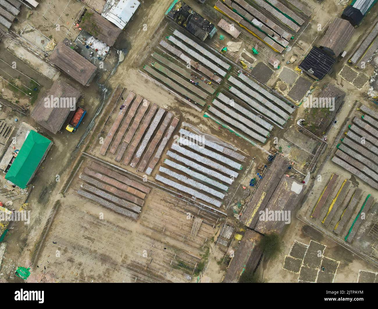 Aerial view of dried fish processing. One of the oldest methods of food ...