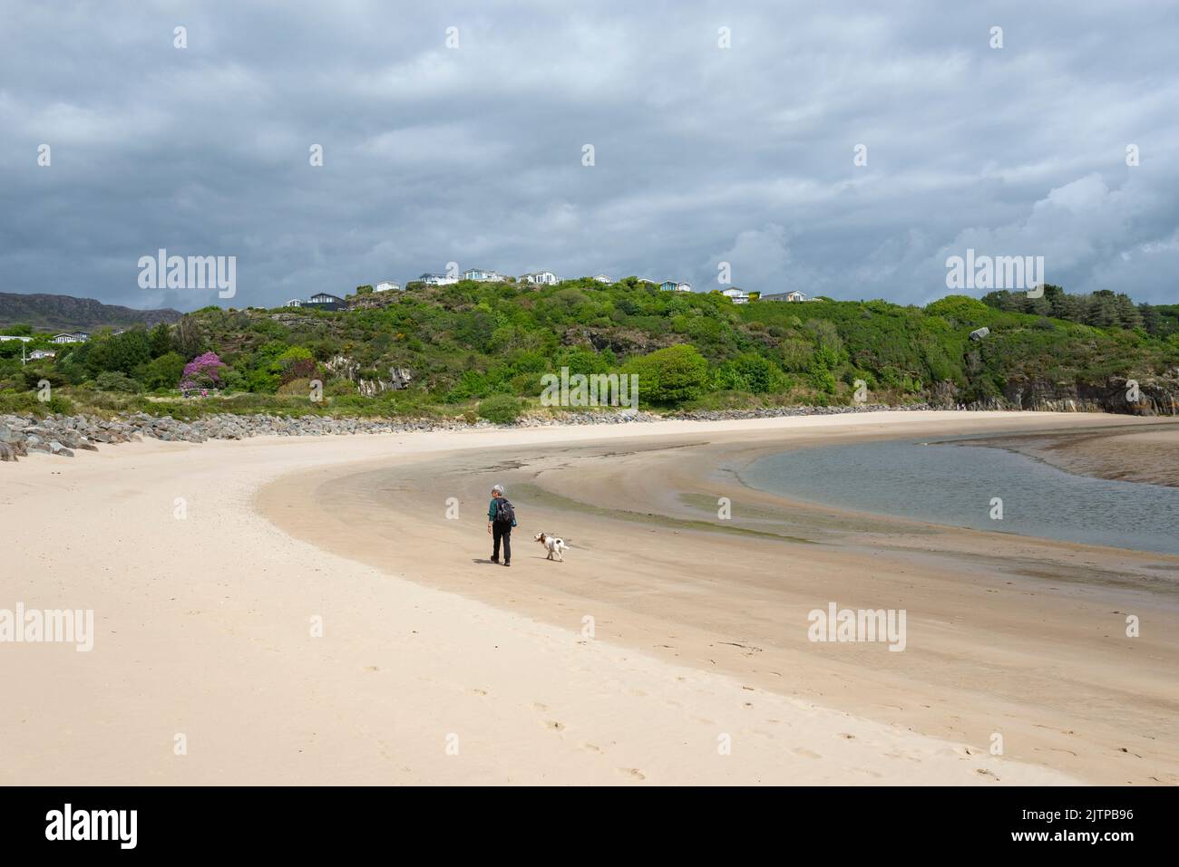 Woman and her dog on the beach between Borth-y-Gest and Ynys Cyngar ...