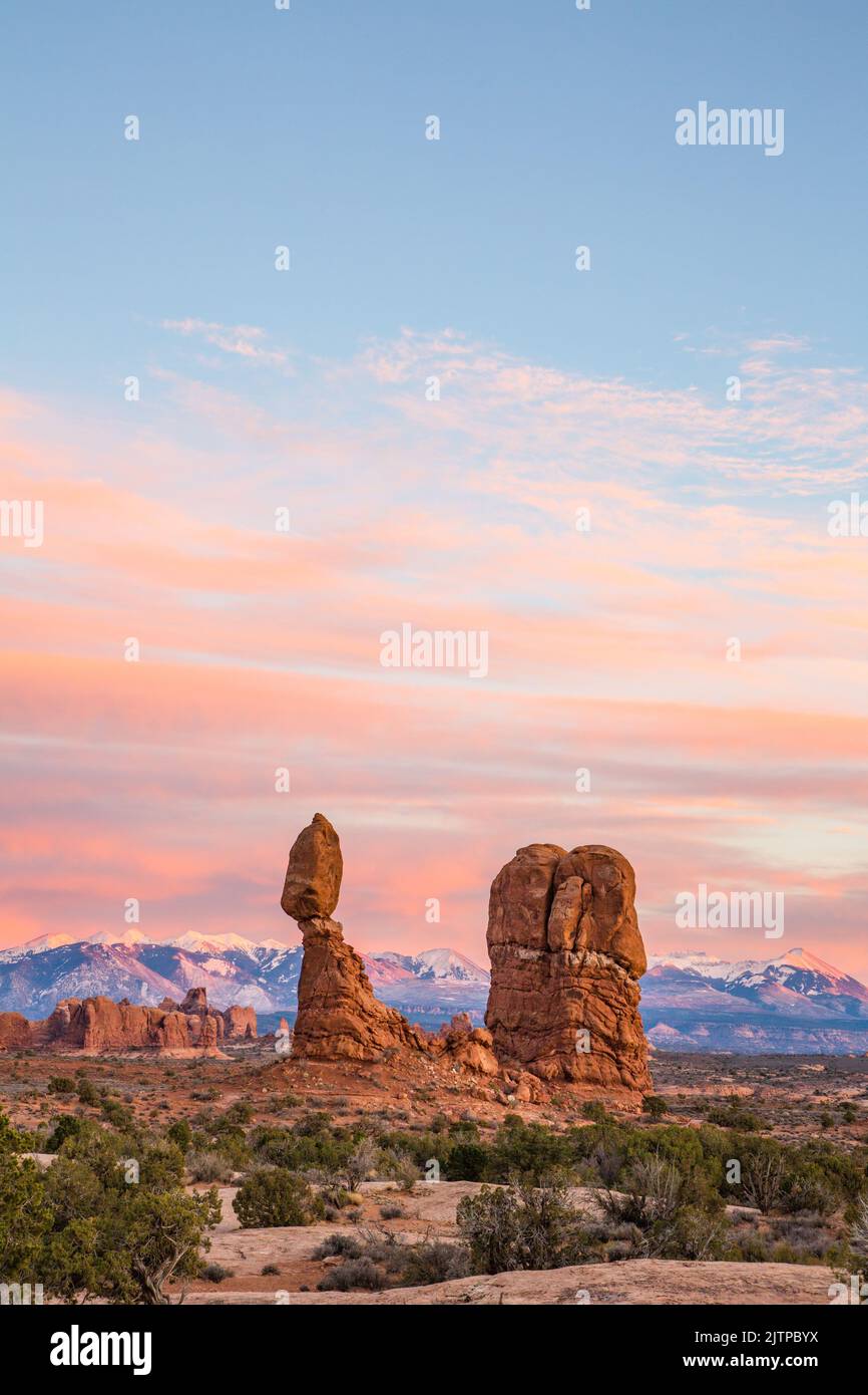 Colorful clouds over the La Sal Mountains in a post-sunset view of ...