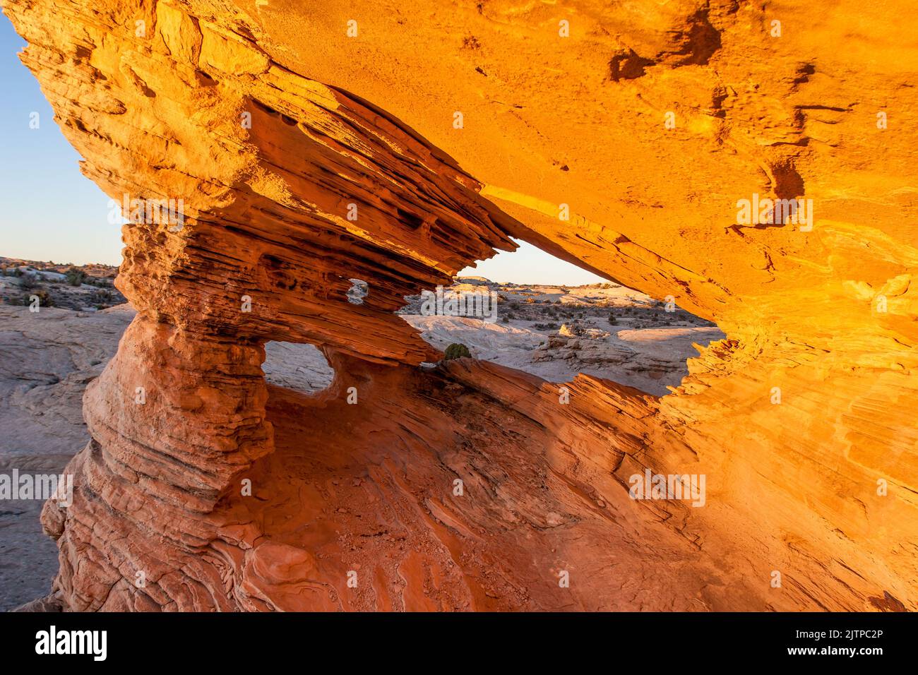 Multiple small arches in the colorful sandstone in the desert near Moab ...