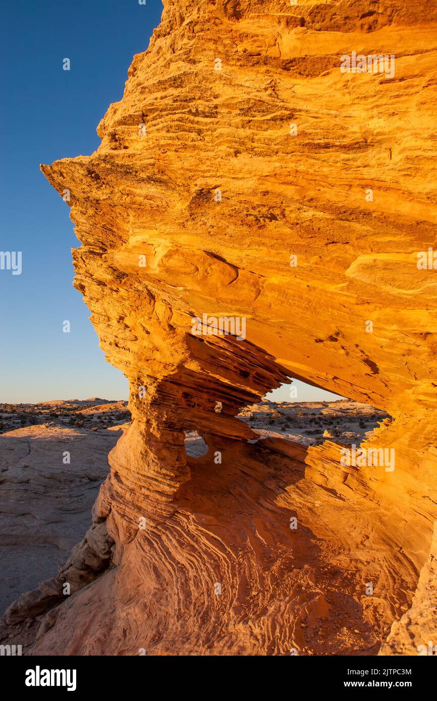 Multiple small arches in the colorful sandstone in the desert near Moab ...