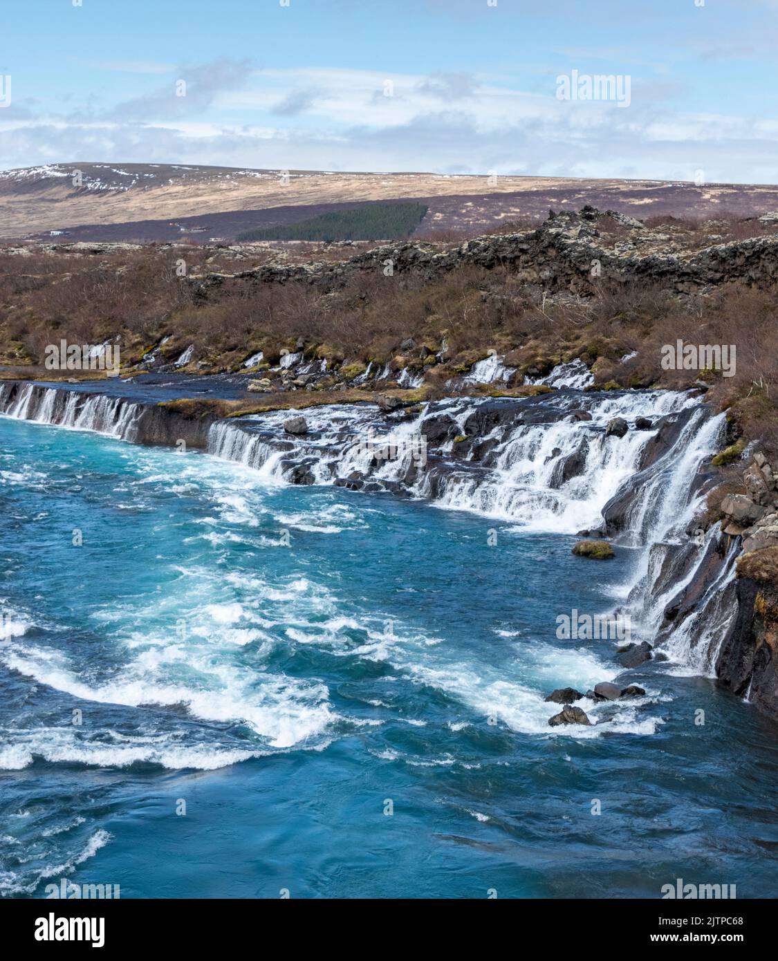 Hraunfossar, waterfalls flowing over a lava field, near Húsafell ...