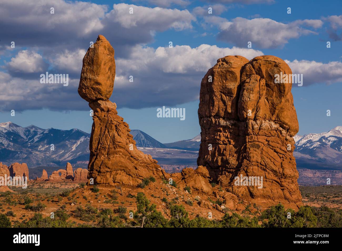 A telephoto view of Balanced Rock with Turret Arch and the La Sal ...