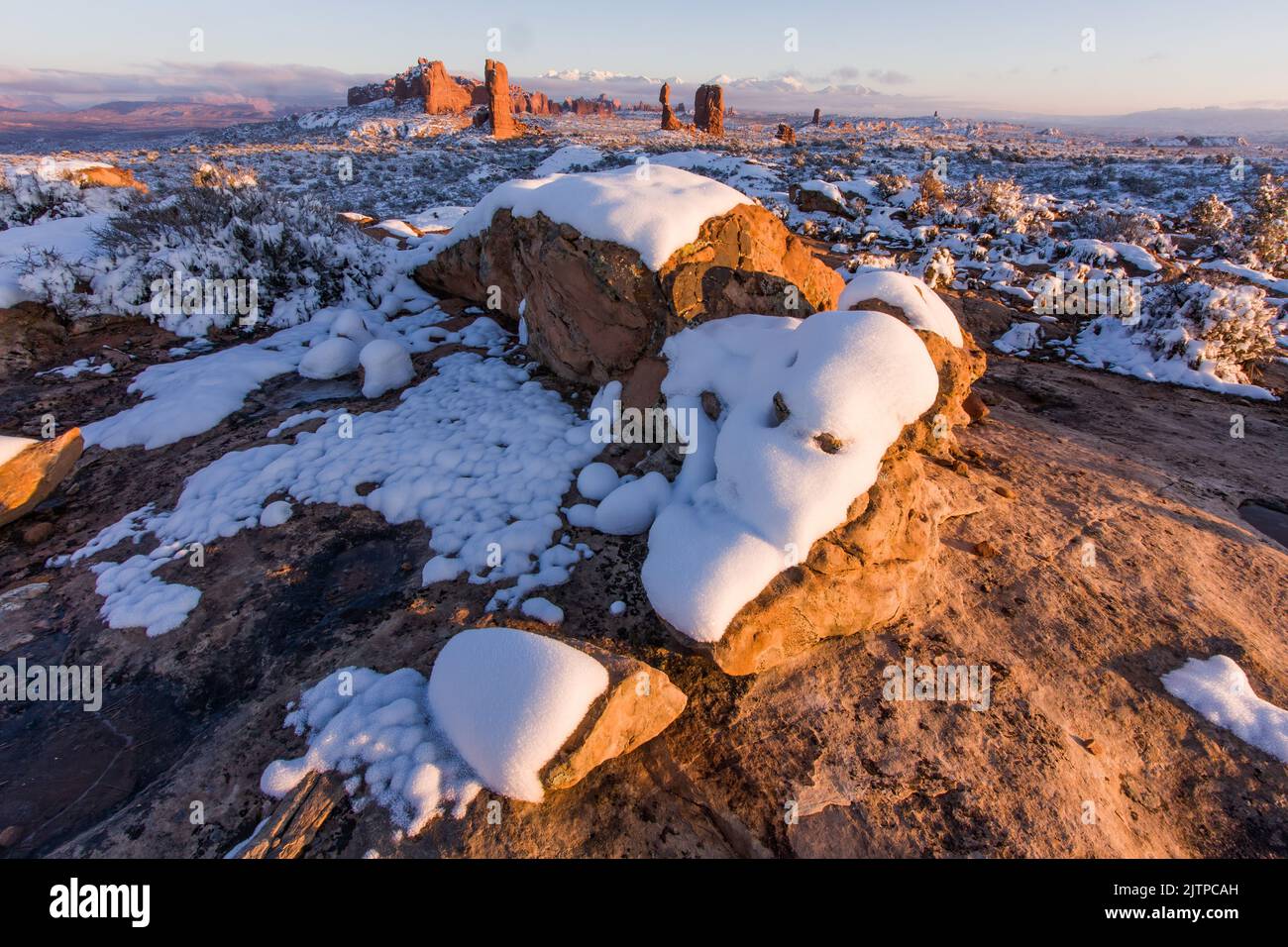 Snow on the sandstone near Balanced Rock after a winter storm in Arches ...