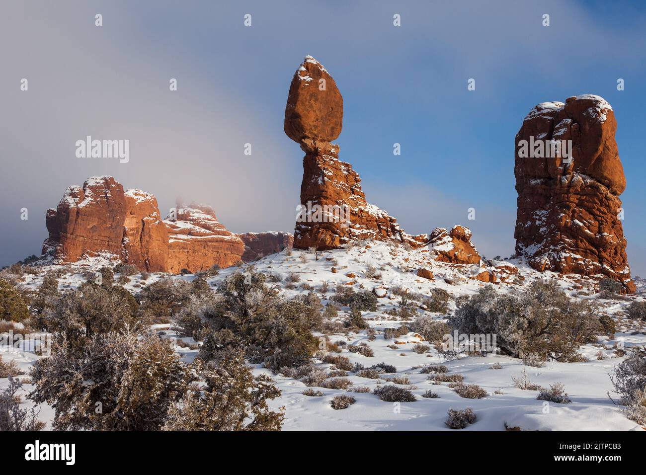 Balanced Rock and Owl Rock after a winter snowfall in Arches National ...