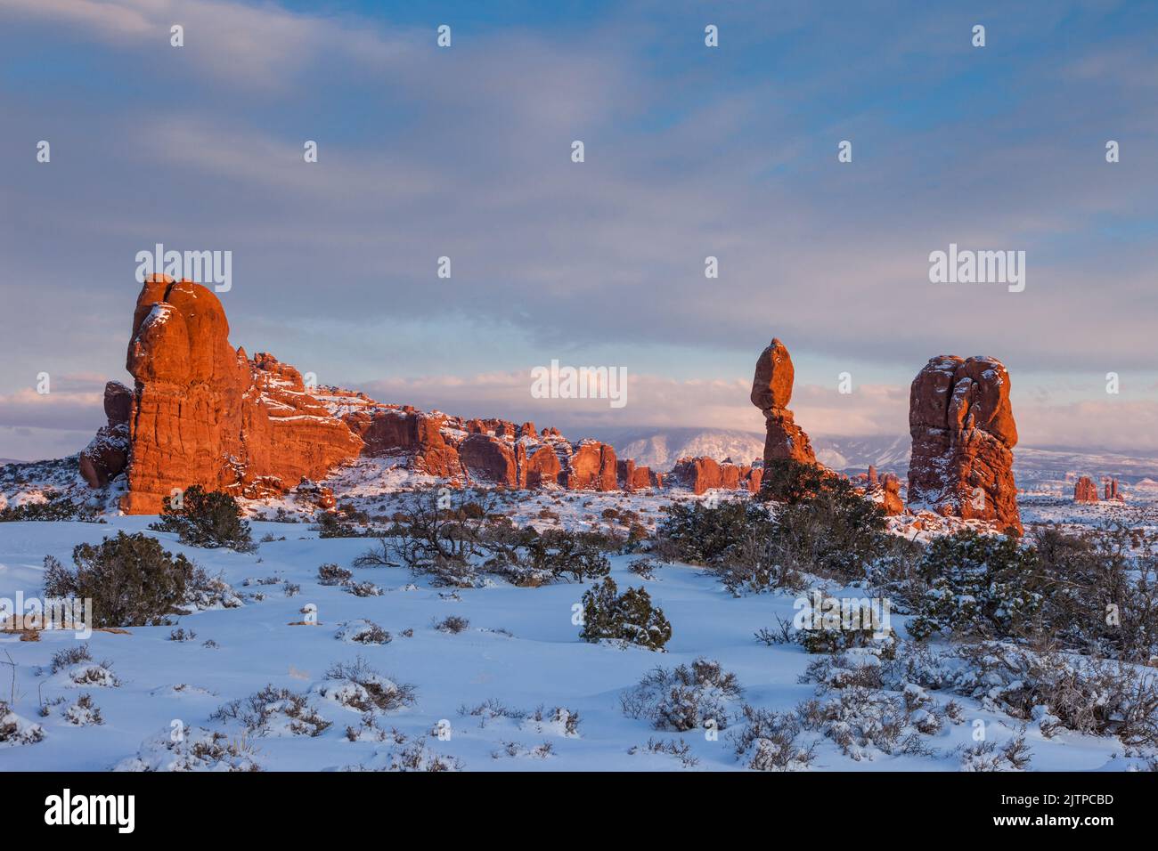 Balanced Rock and Owl Rock after a winter snowfall in Arches National ...