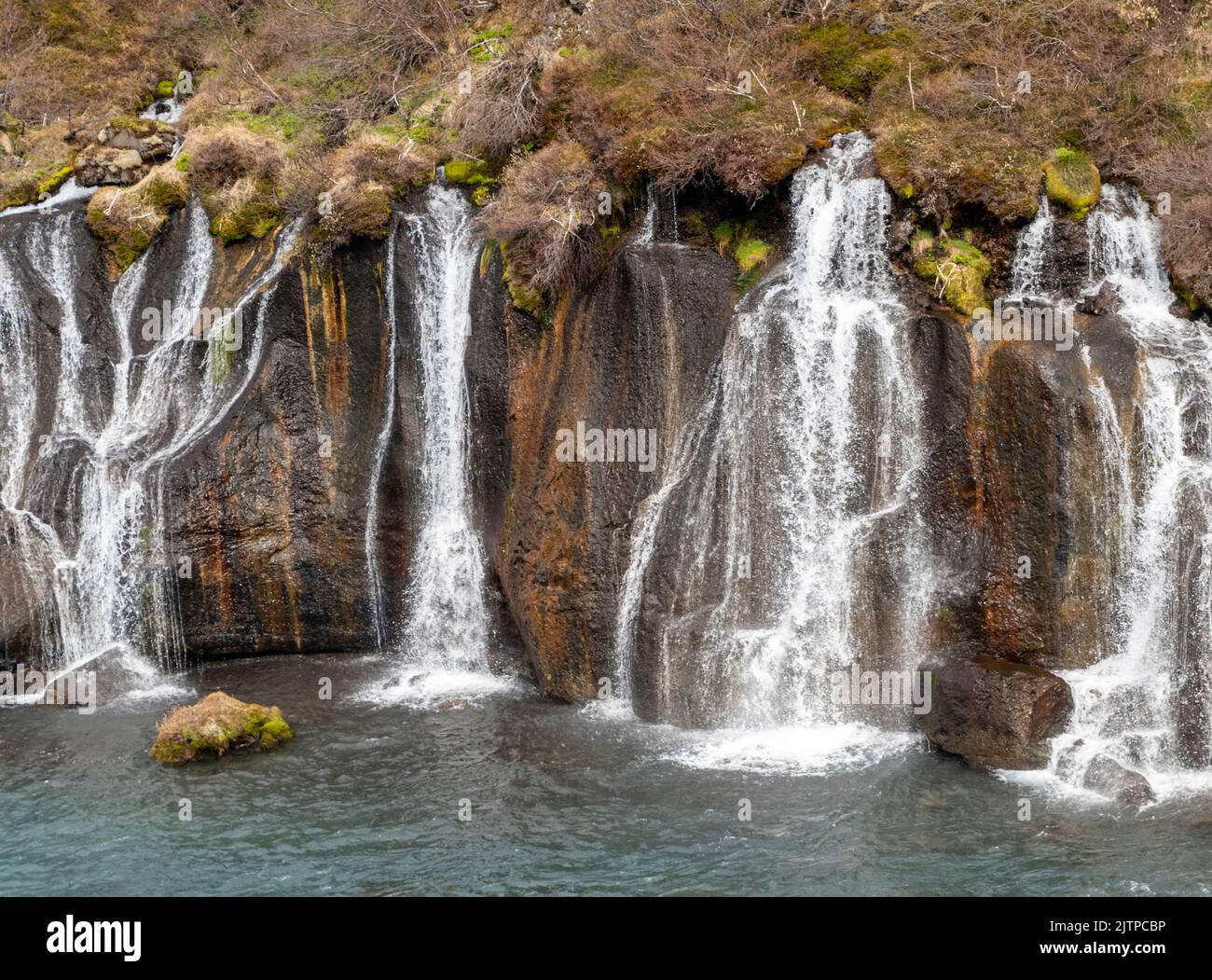 Hraunfossar, waterfalls flowing over a lava field, near Húsafell ...