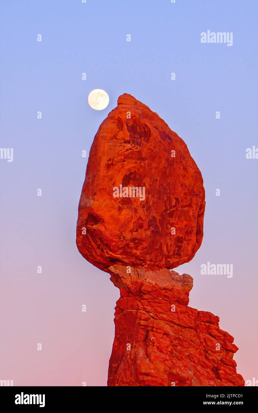 Rising moon behind Balanced Rock in Arches National Park, Moab, Utah ...