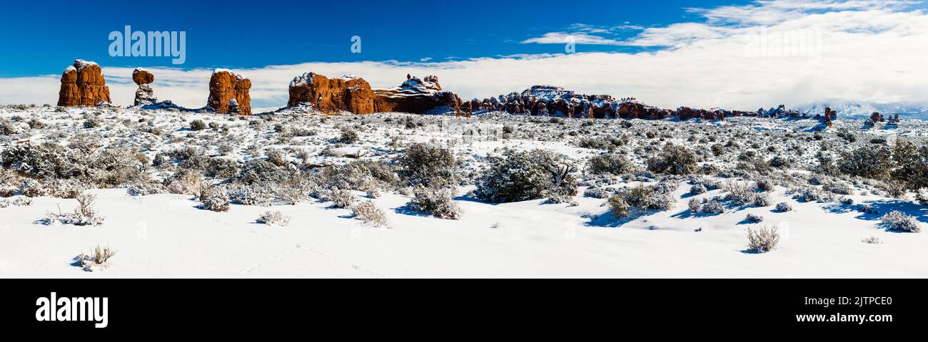 Panorama of Balanced Rock and Ham Rock Butte in winter snow in Arches ...