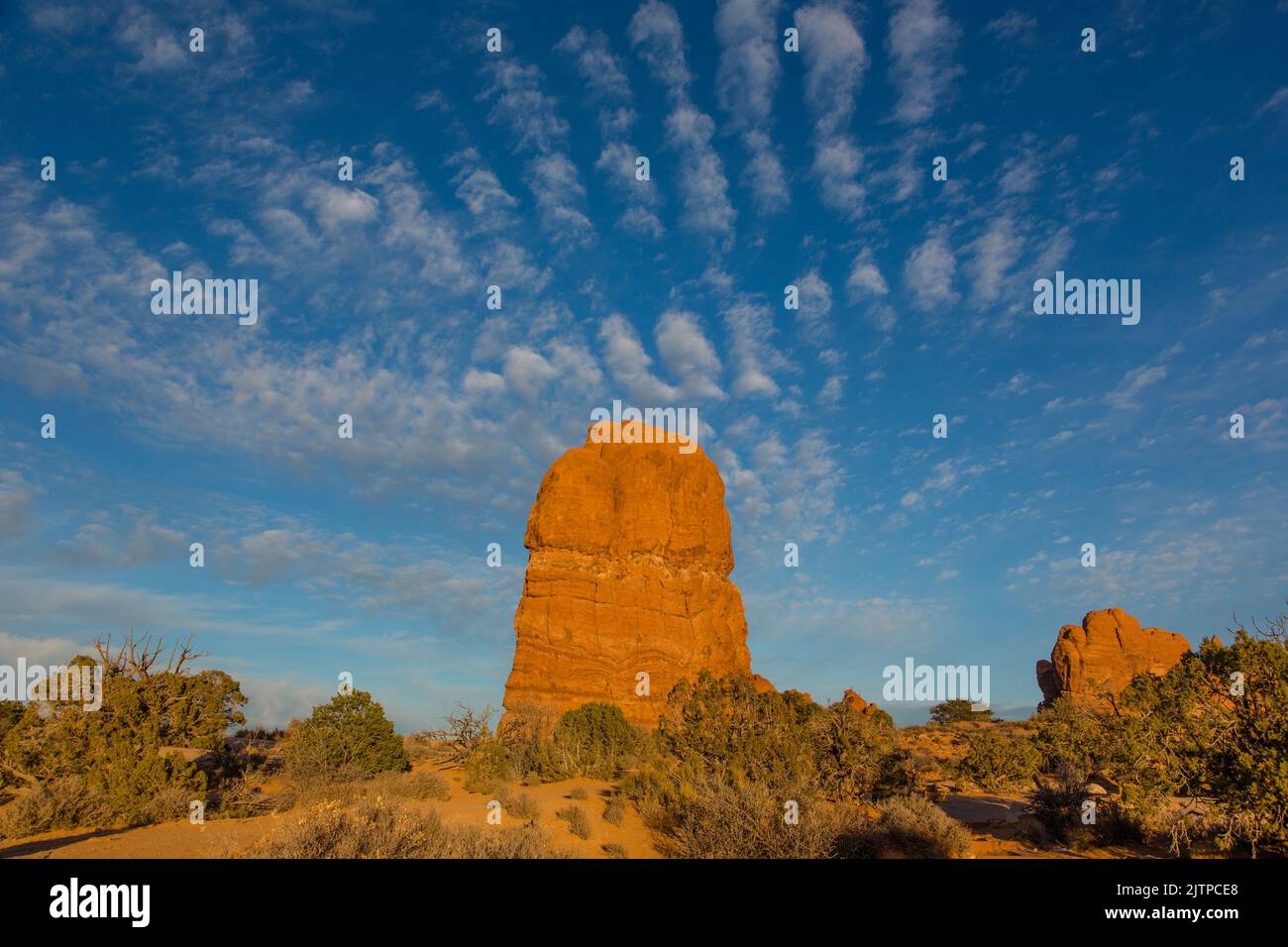 Entrada Sandstone formation with buttermilk clouds in the Balanced Rock ...