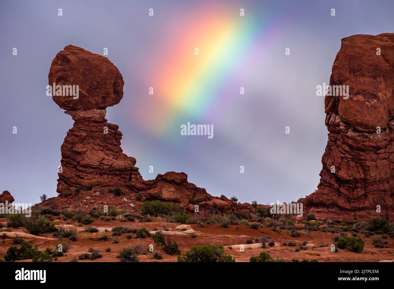 A rainbow behind Balanced Rock in Arches National Park, Moab, Utah ...