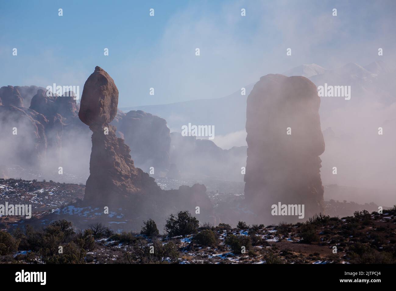 Clearing fog around Balanced Rock in winter in Arches National Park ...
