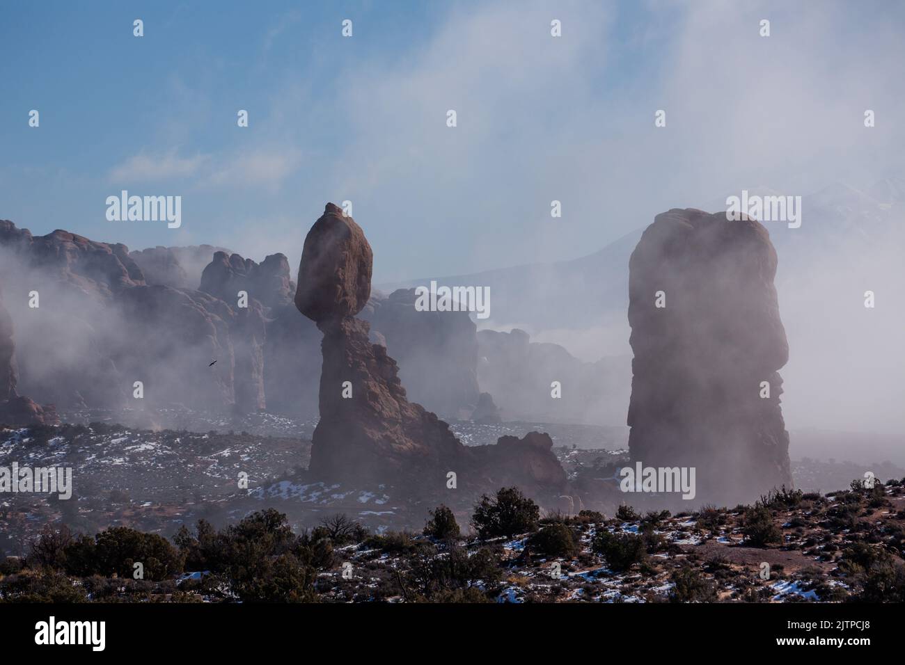 Clearing fog around Balanced Rock in winter in Arches National Park ...