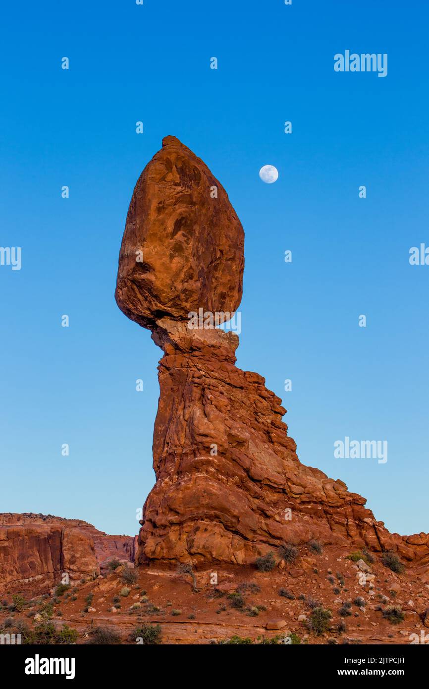 Rising moon behind Balanced Rock in Arches National Park, Moab, Utah ...