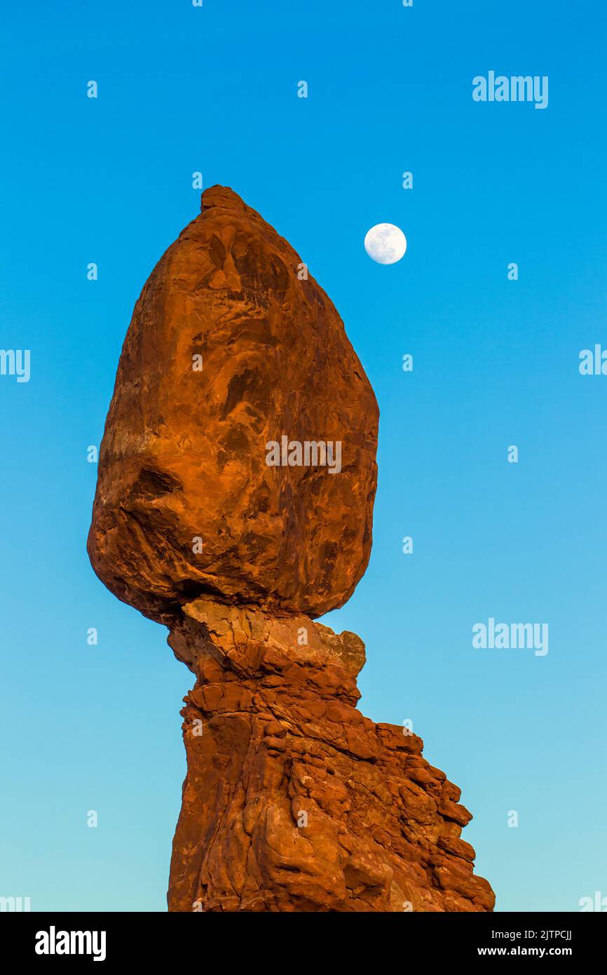 Rising moon behind Balanced Rock in Arches National Park, Moab, Utah ...