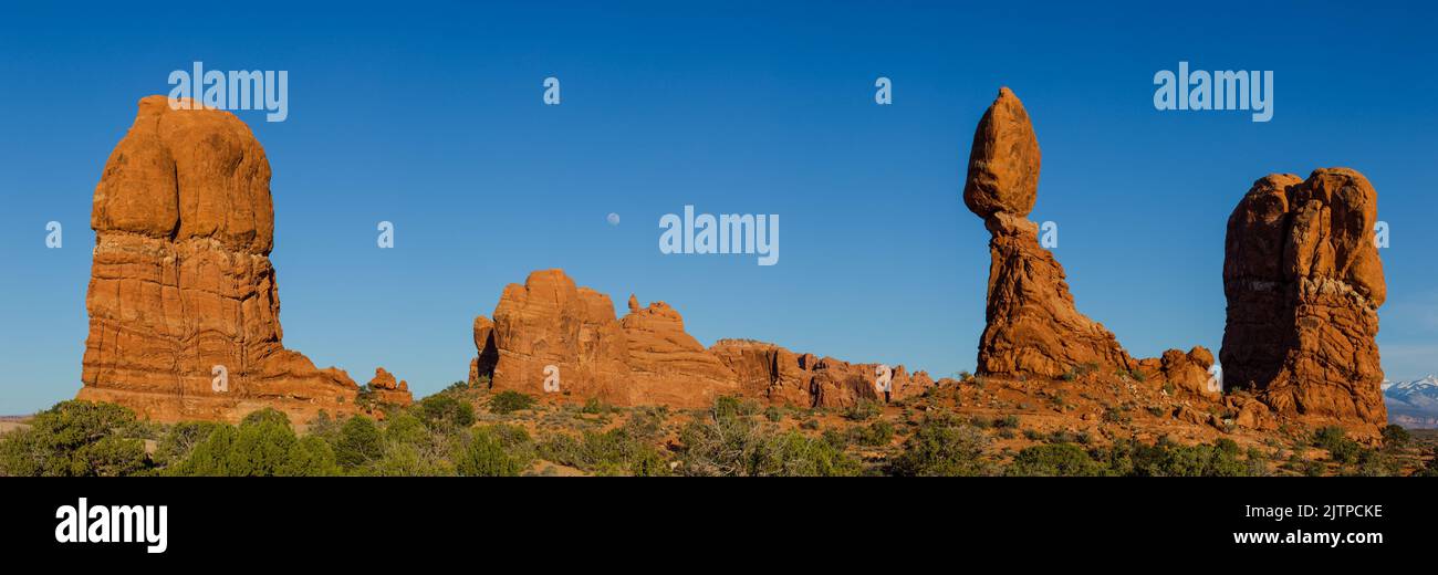 Panorama of the moon over Balanced Rock and Ham Rock Butte in Arches ...