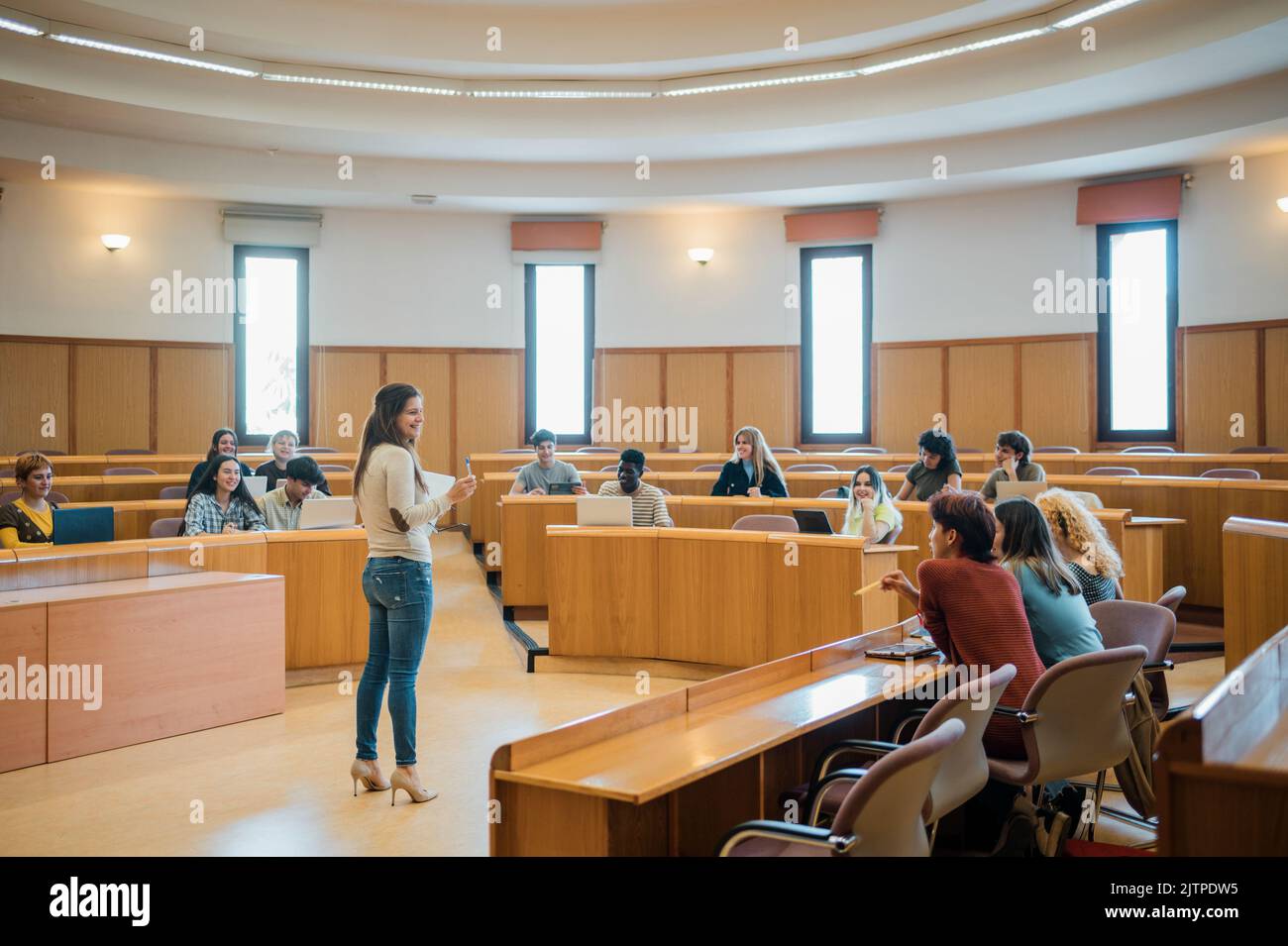 Cheerful teacher and students during lecture Stock Photo - Alamy Cheerful teacher and students during lecture Stock Photo - Alamy