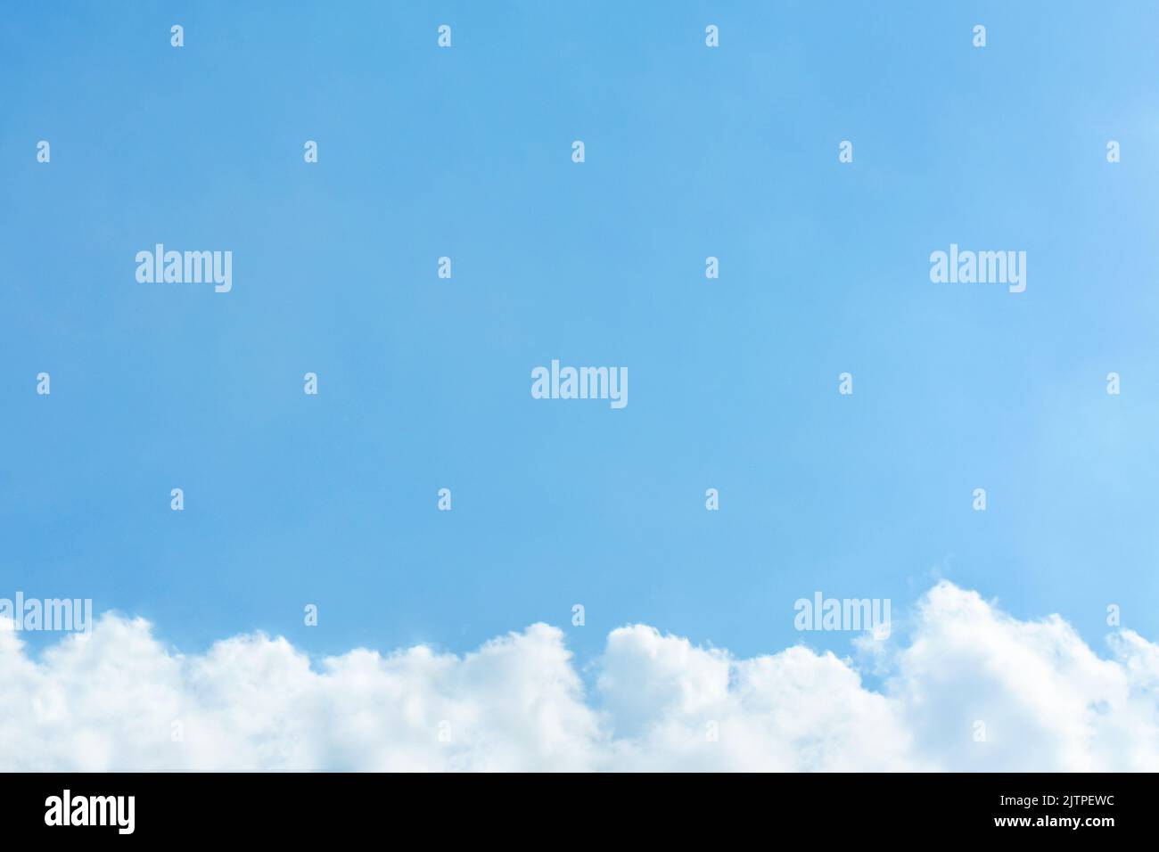 Pastel blue sky with white clouds background Stock Photo - Alamy