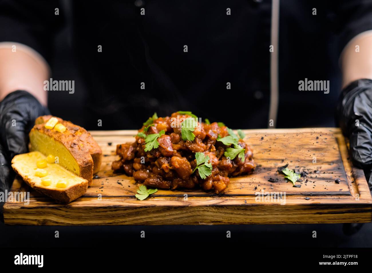 restaurant service chef cornbread boston beans Stock Photo - Alamy
