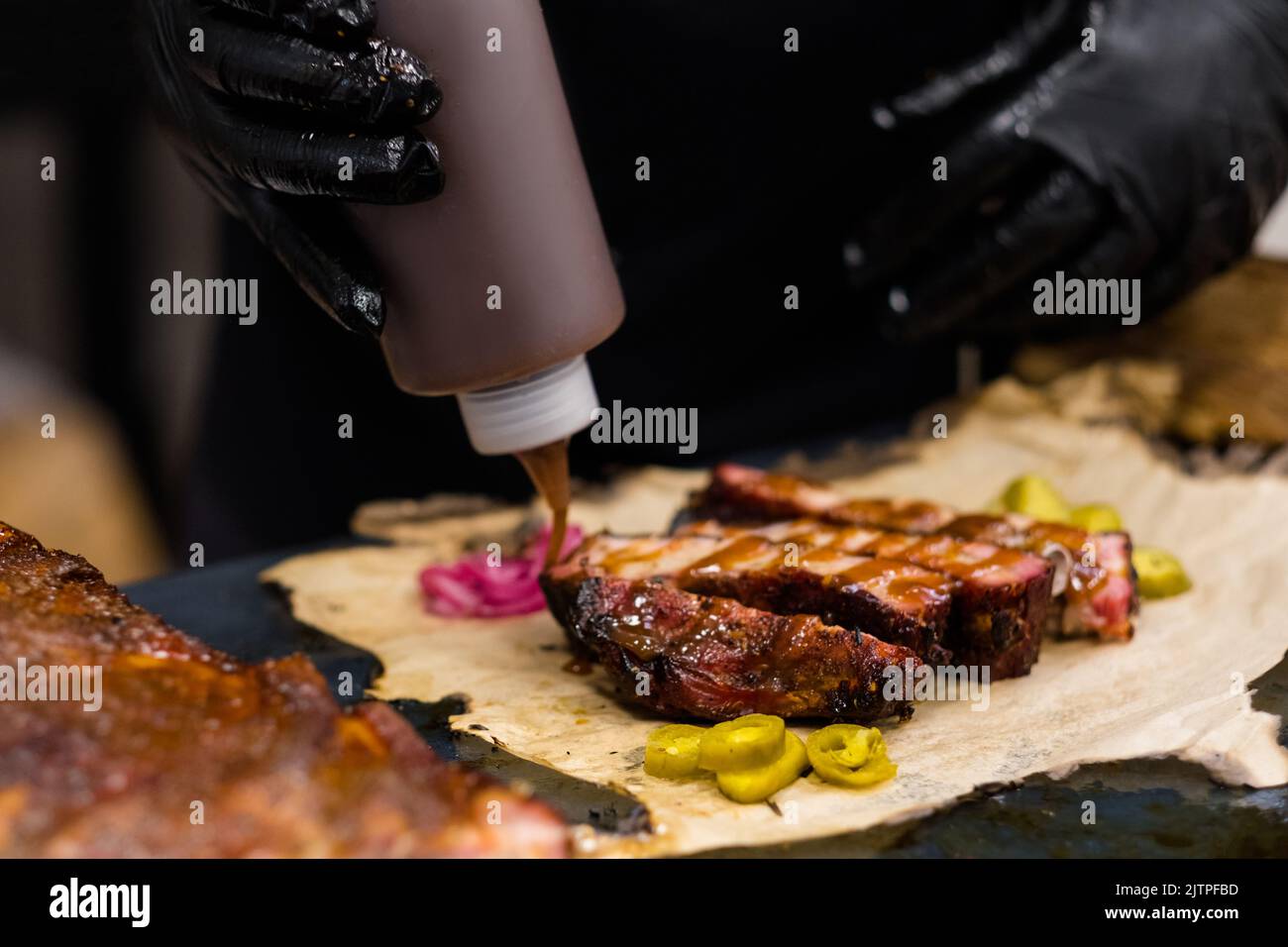 grill restaurant kitchen sauce smoked pork ribs Stock Photo - Alamy