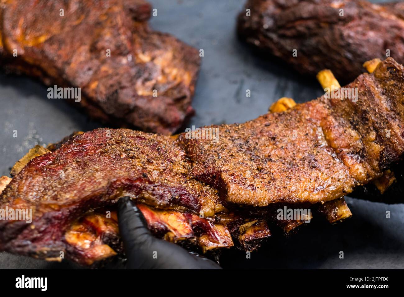 grill restaurant kitchen smoked pork ribs chef Stock Photo - Alamy