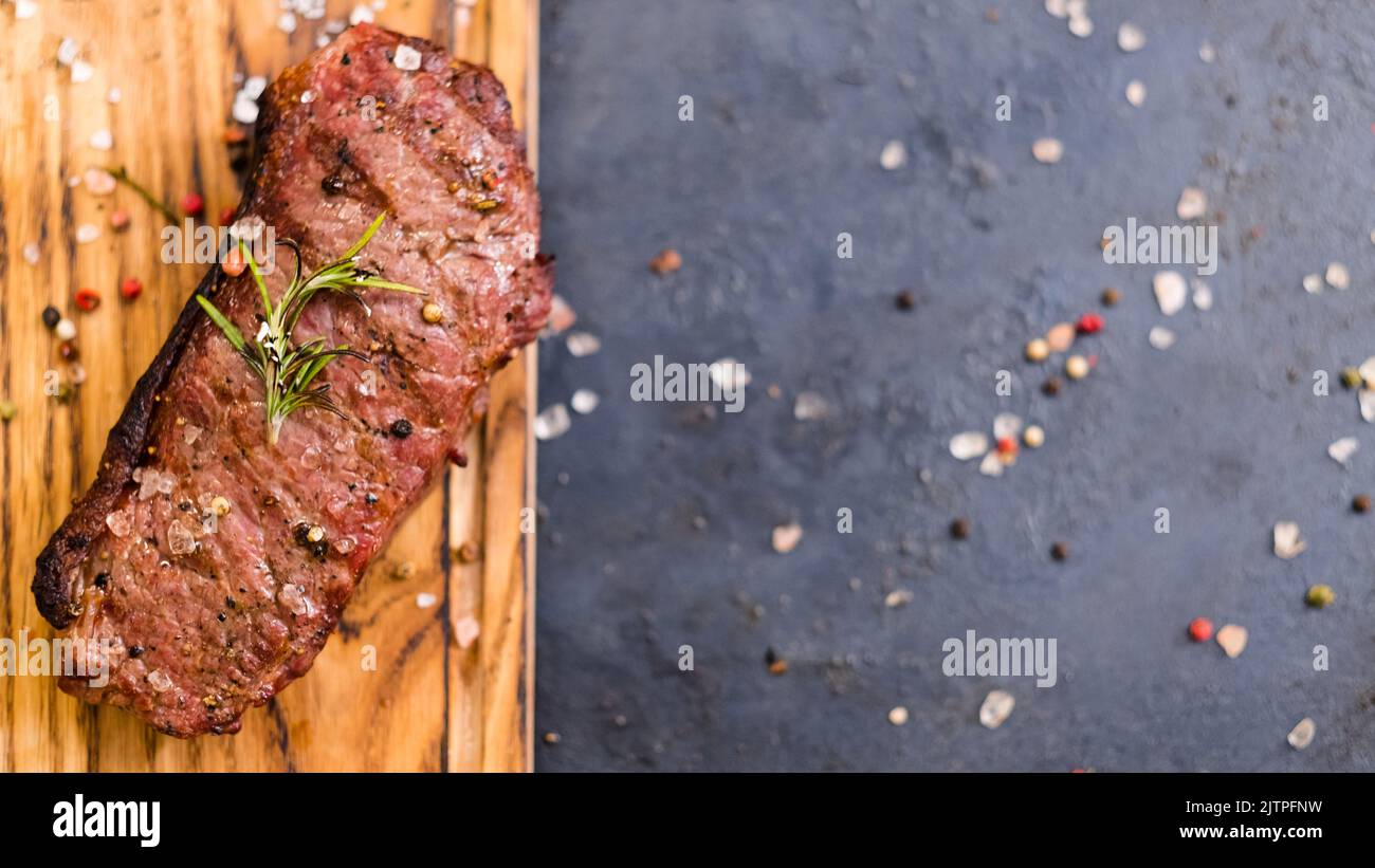 steakhouse food striploin steak beef meat rosemary Stock Photo - Alamy