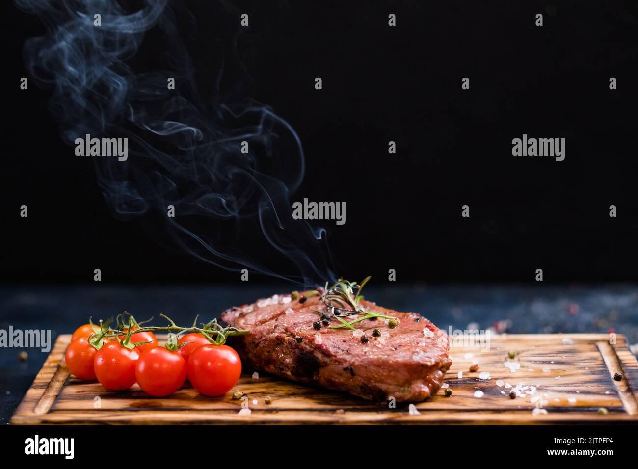 steakhouse menu rib eye steak beef meat rosemary Stock Photo - Alamy
